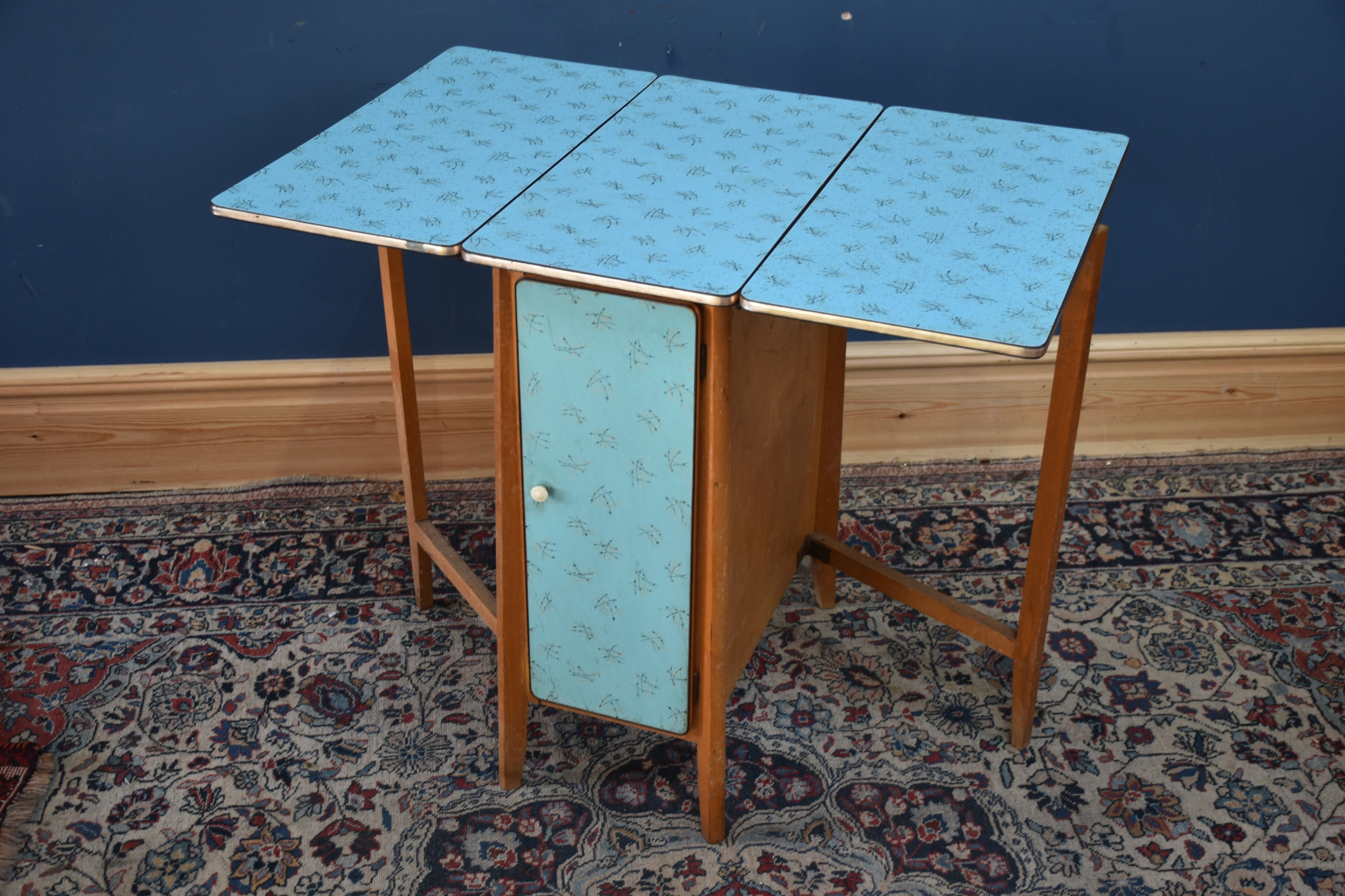 Lot 320 A 1950s Formica drop leaf table with single
