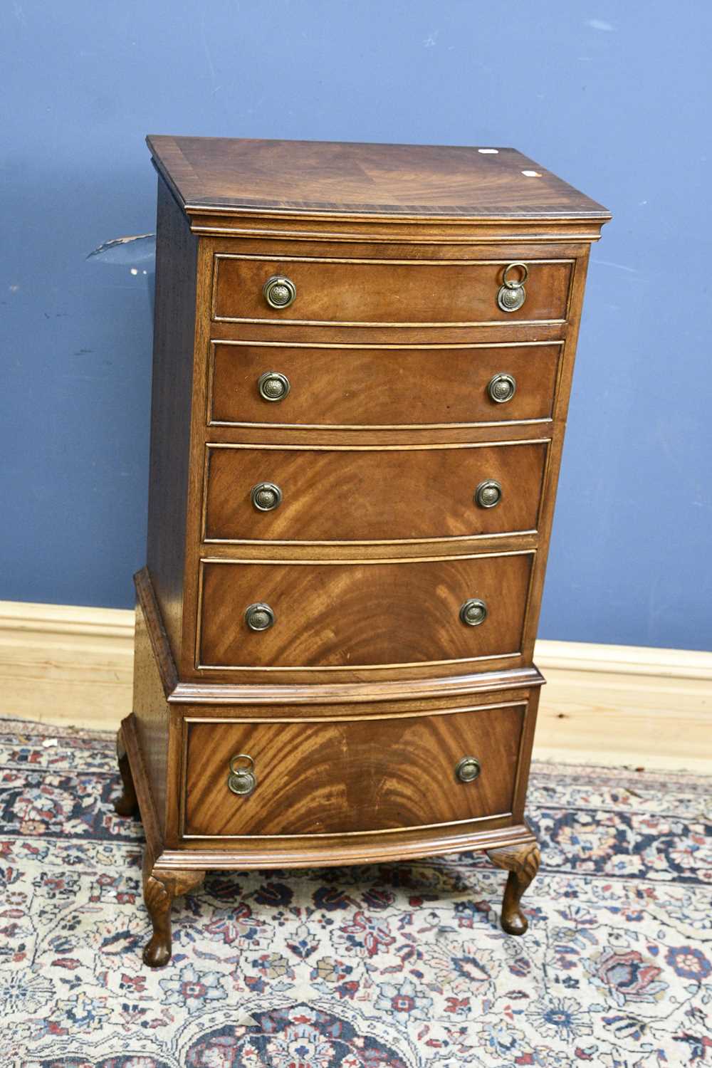 Lot 229 - A reproduction walnut five drawer chest,