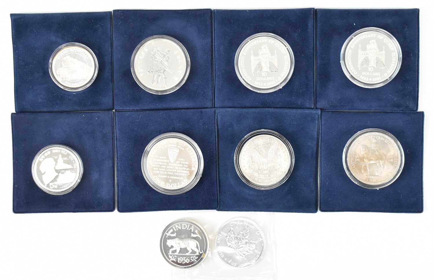 Lot 826 - A group of silver coins including dollars,