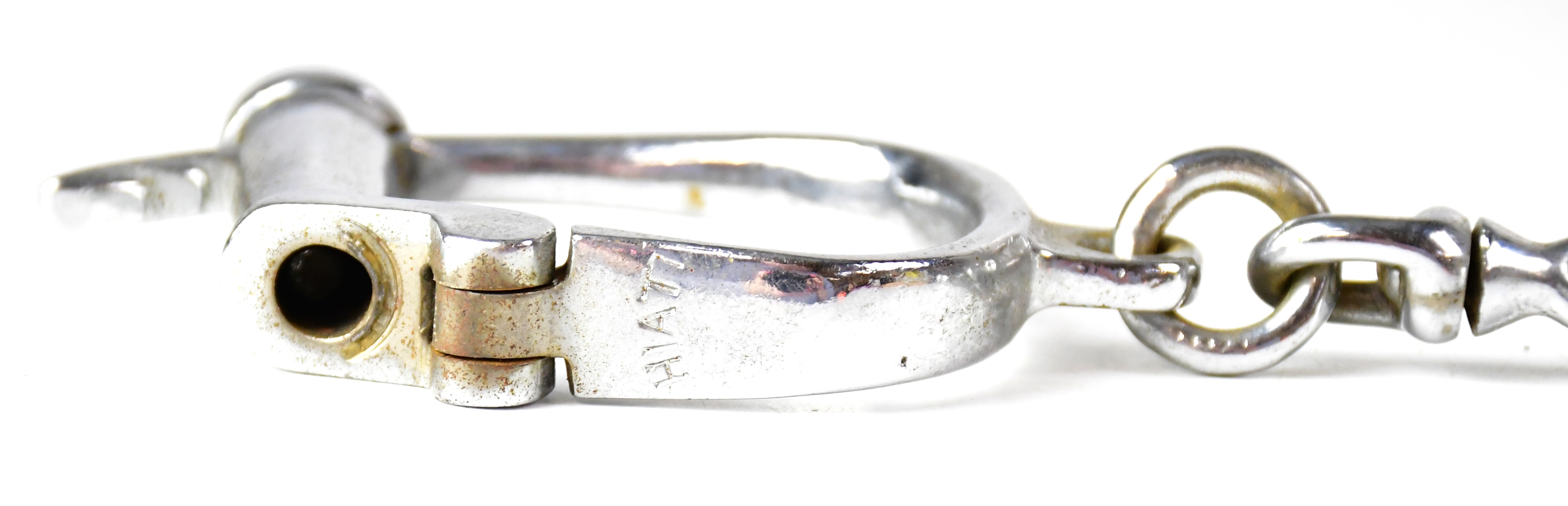 Lot 576 - A pair of vintage chrome plated handcuffs