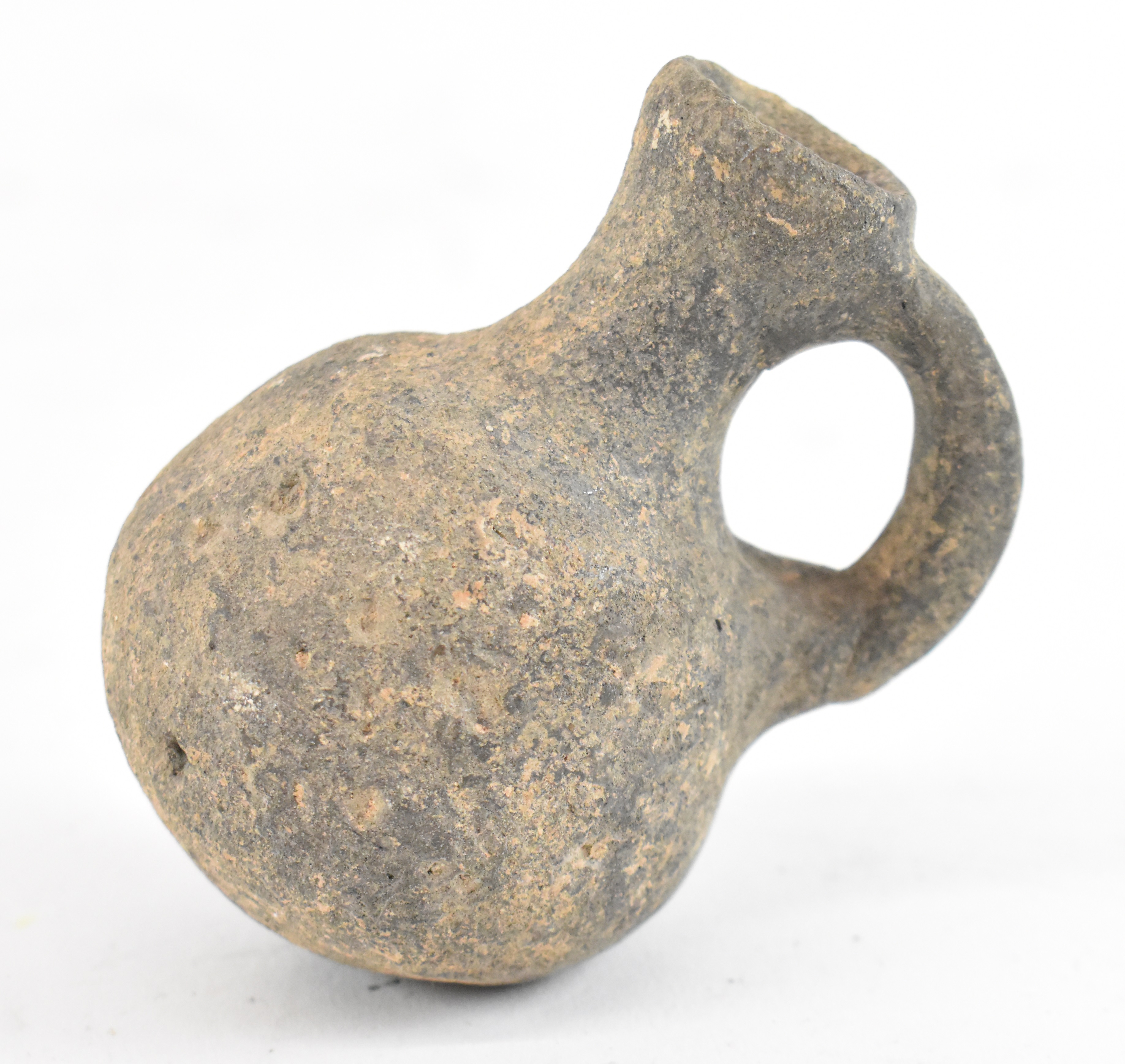 Lot 555 - A small Ancient Israeli stoneware jug, with