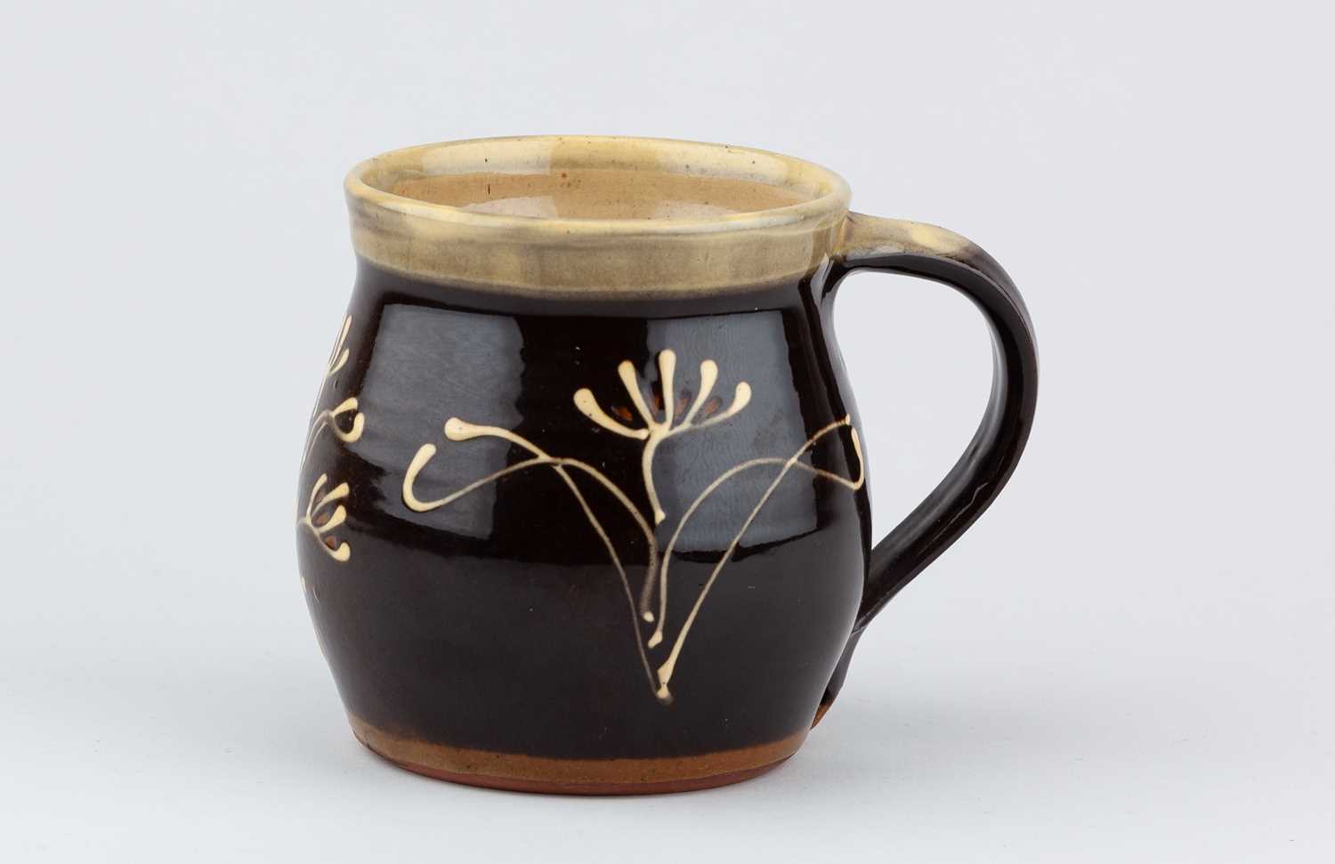 Lot 444 - PAUL BARRON (1917-1983); a slipware mug with