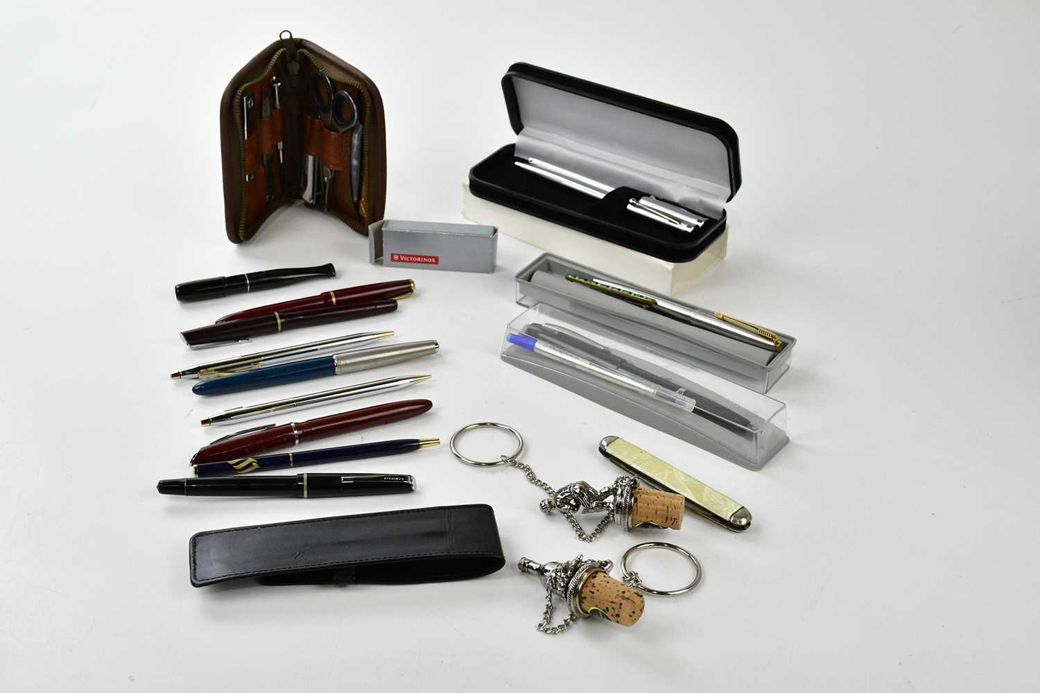 Lot 1381 - A small group of pens, including a red