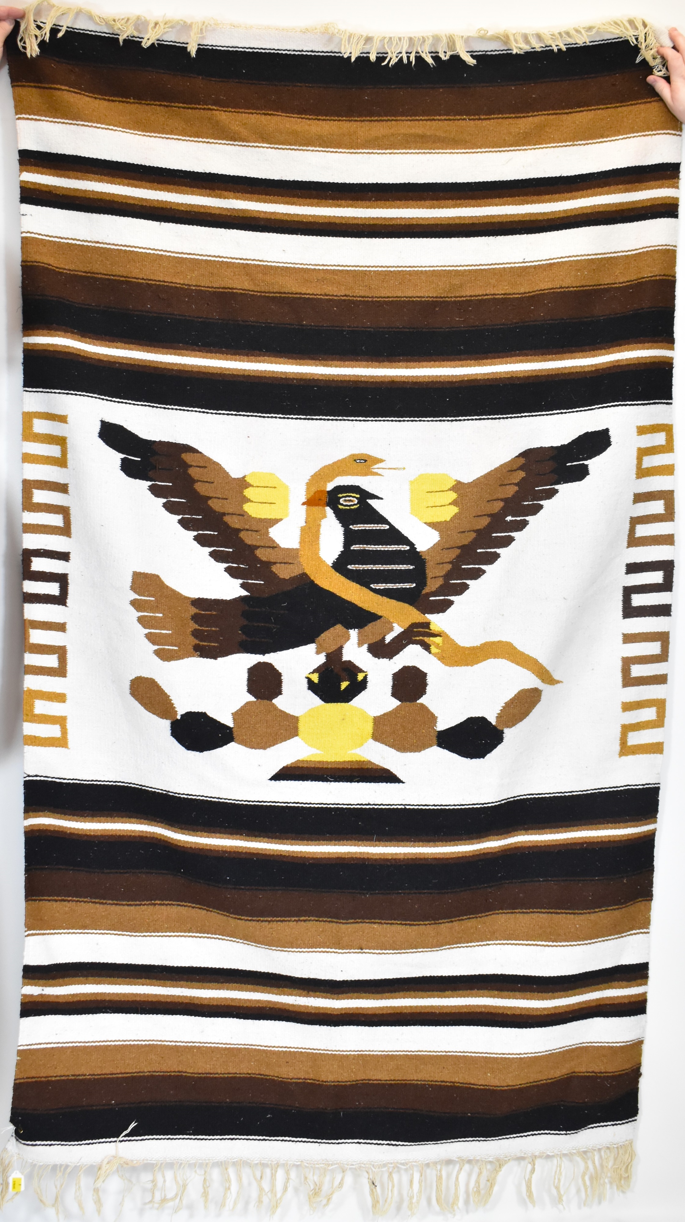 Lot 88 - Four 1970s Mexican Aztec wall hangings/rugs,