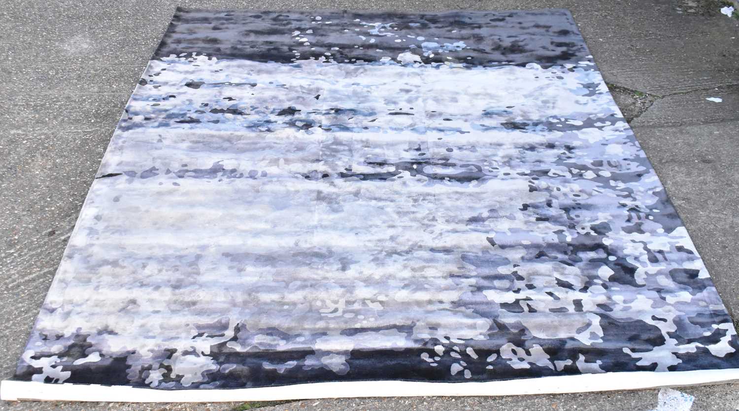 Lot 138 - A large modern purple ground carpet, 400 x