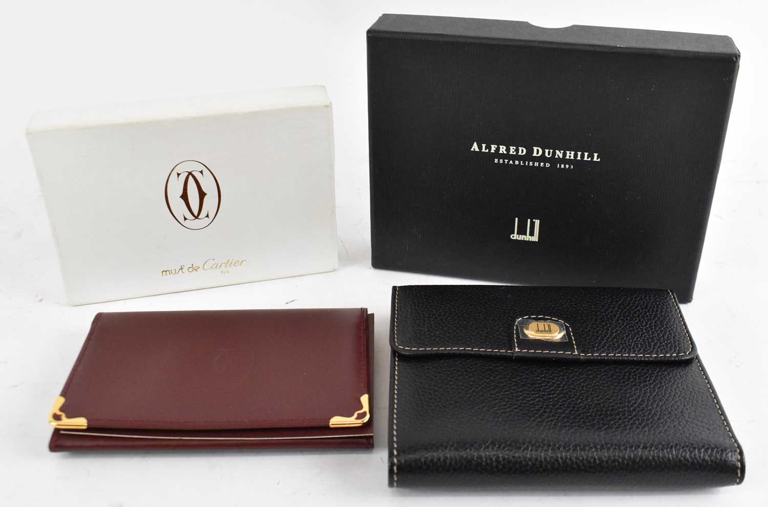 Lot 446 - ALFRED DUNHILL; a boxed leather purse with