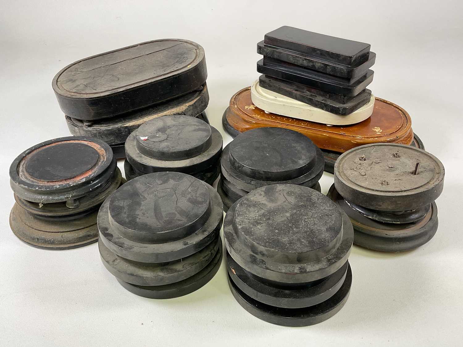 Lot 216 - A quantity of glass dome bases, the majority