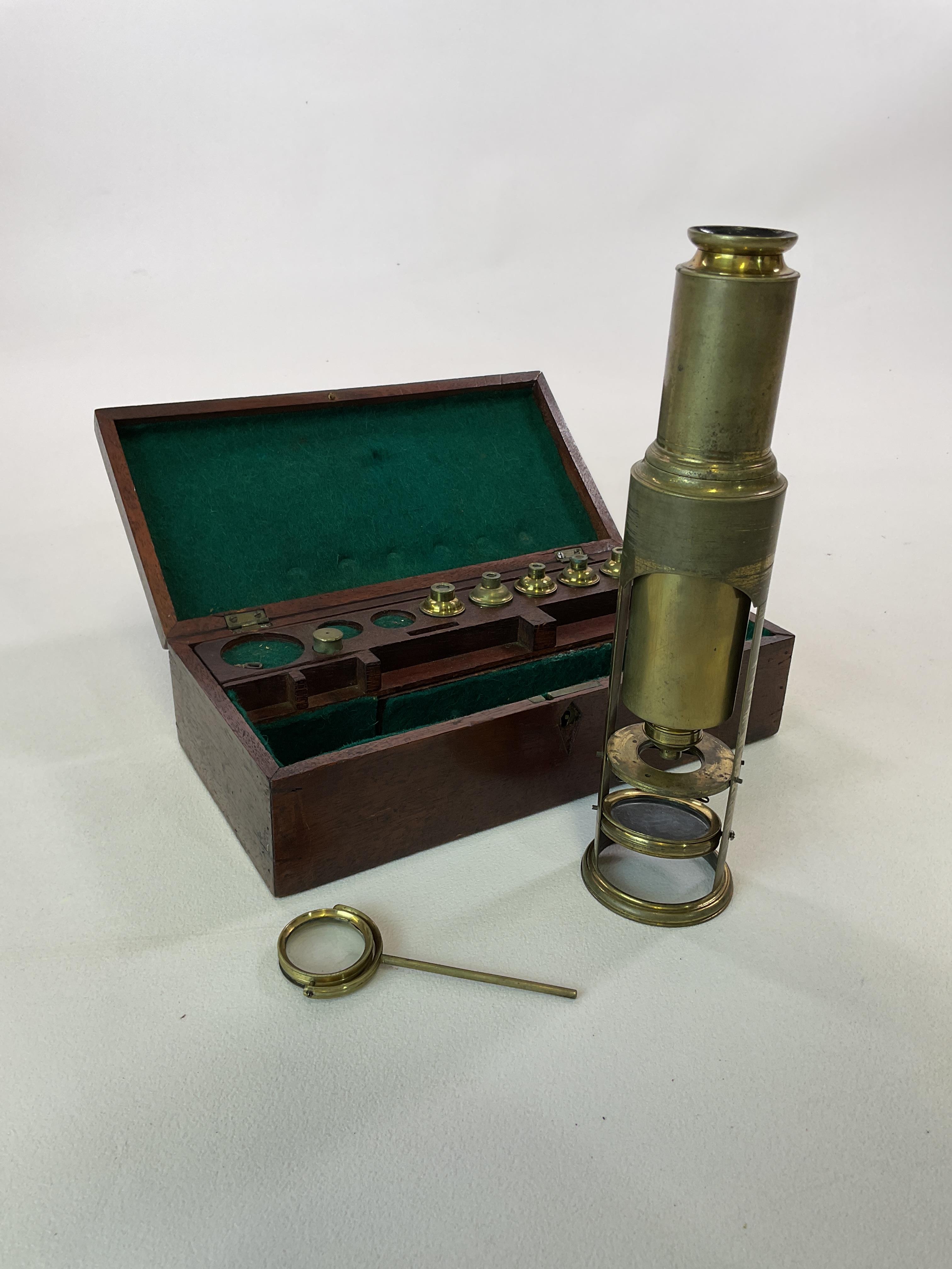 Lot 46 - A mahogany cased brass Cuff type microscope,