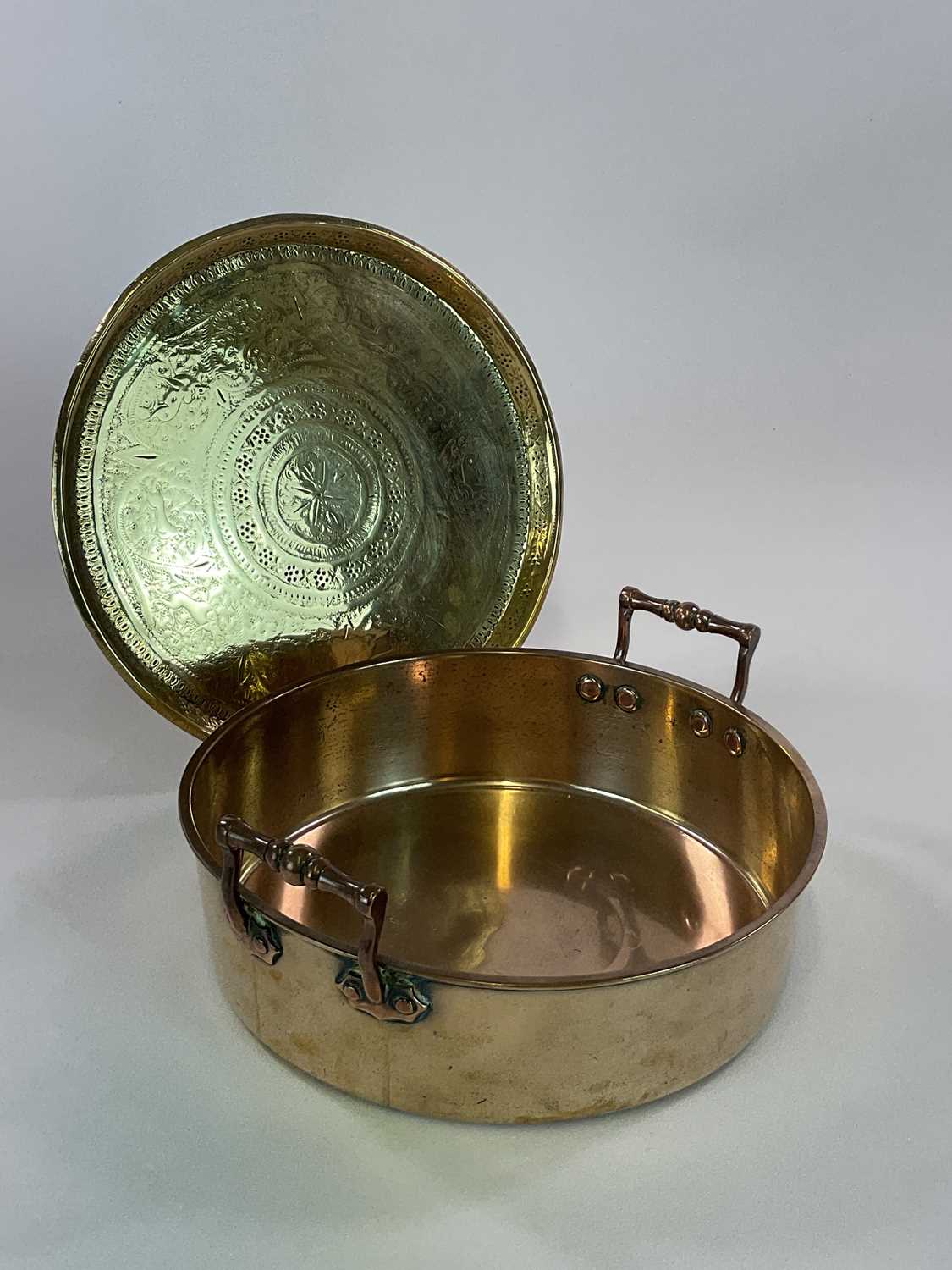Lot 438 - A copper preserving pan, width 32cm, and a