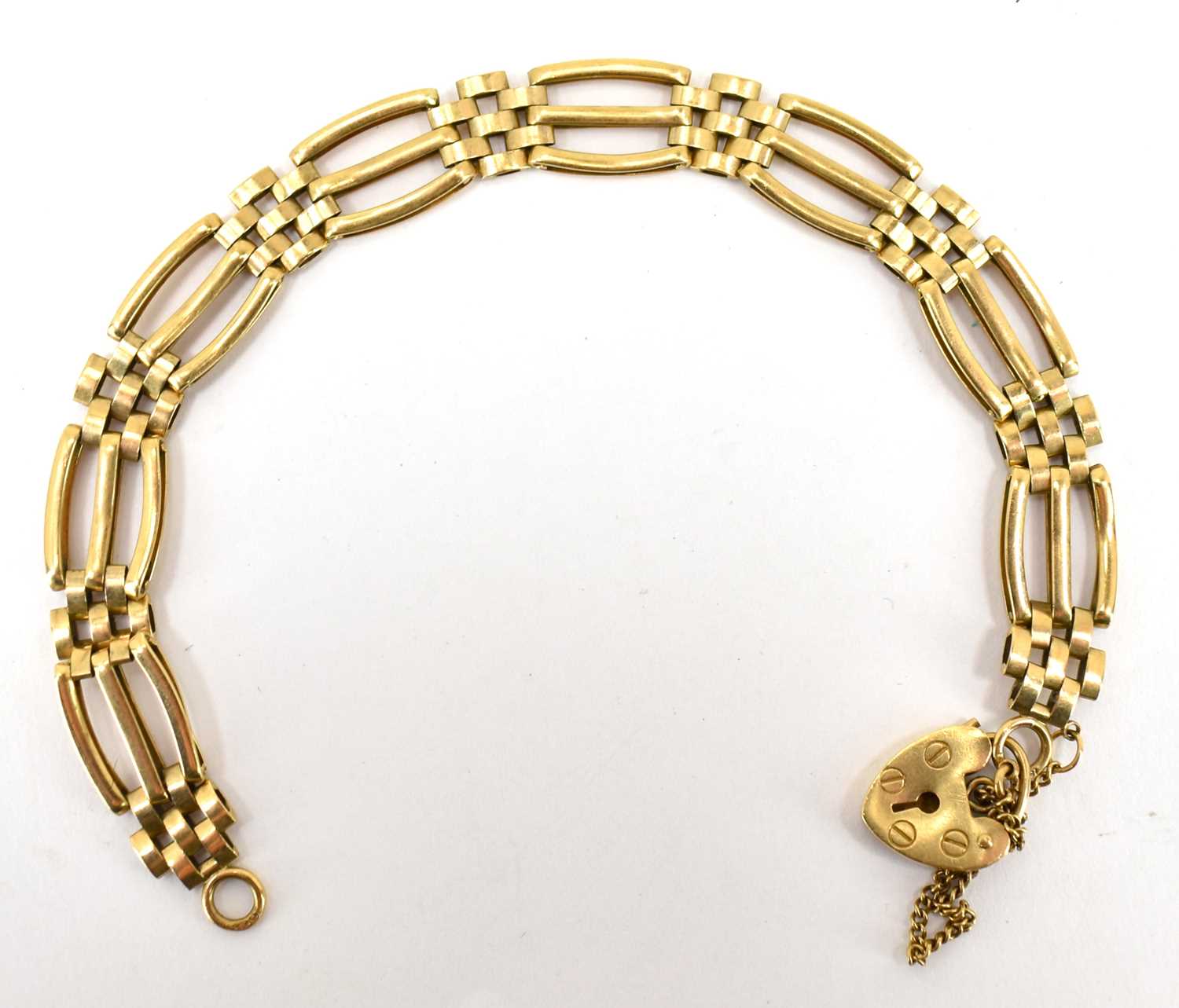 Lot 750 - A 9ct gold three-bar link gate bracelet with