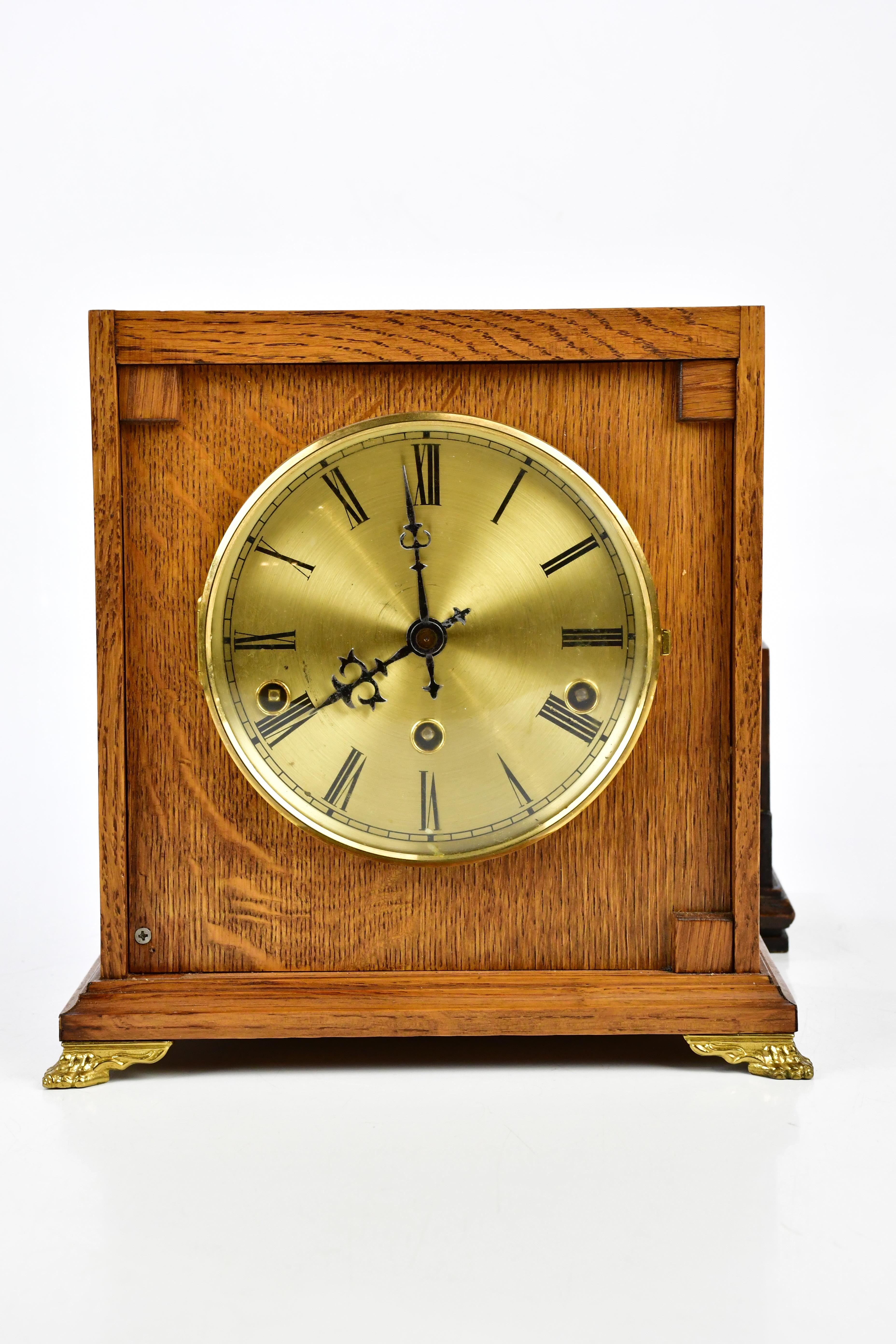 Lot 1511 - BRAVINGTONS; an oak cased mantel clock set