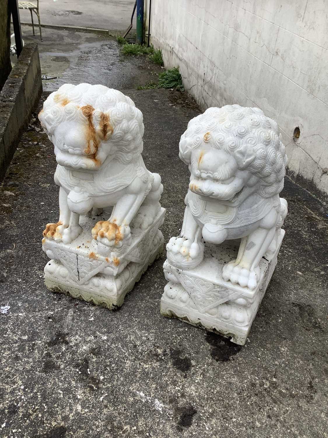 Lot 1219 - A pair of Chinese carved marble models of