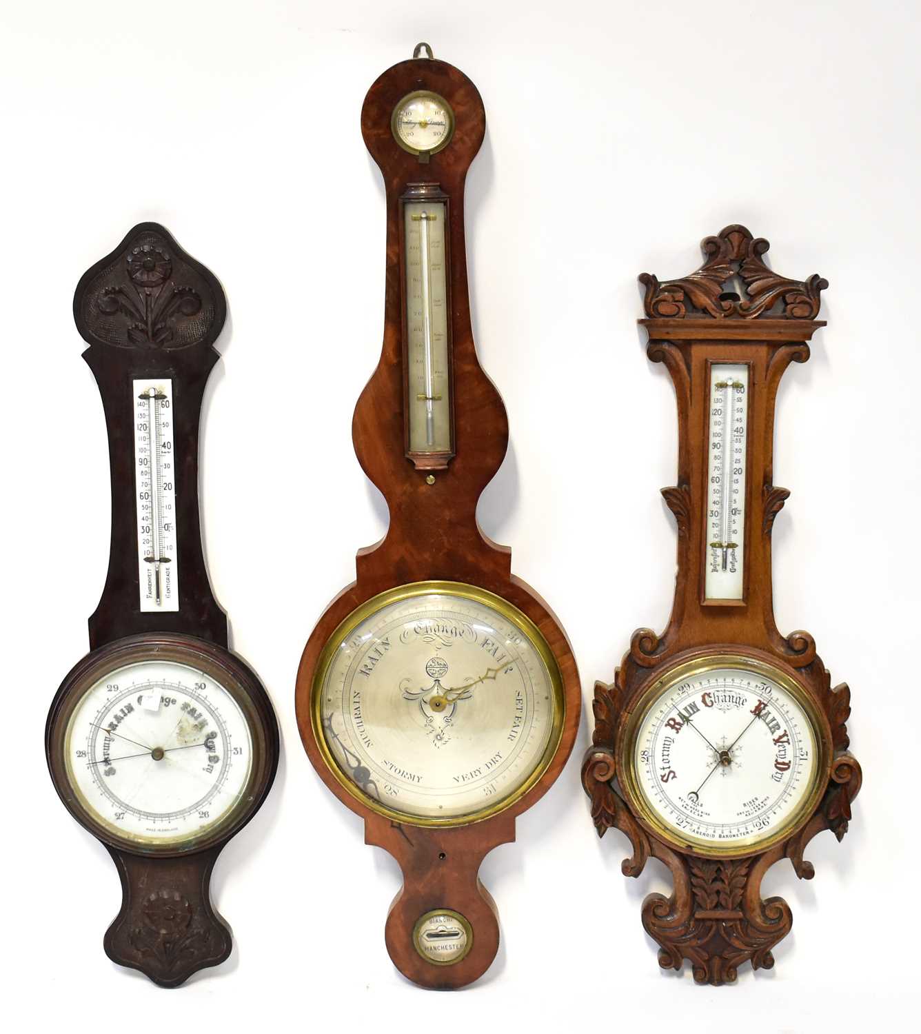 Lot 147 - Two carved Victorian barometer/thermometers