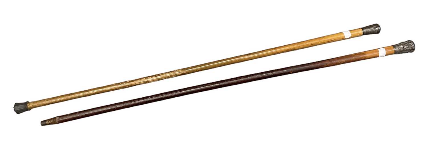 Lot 318 - A white metal mounted cane with ribbed