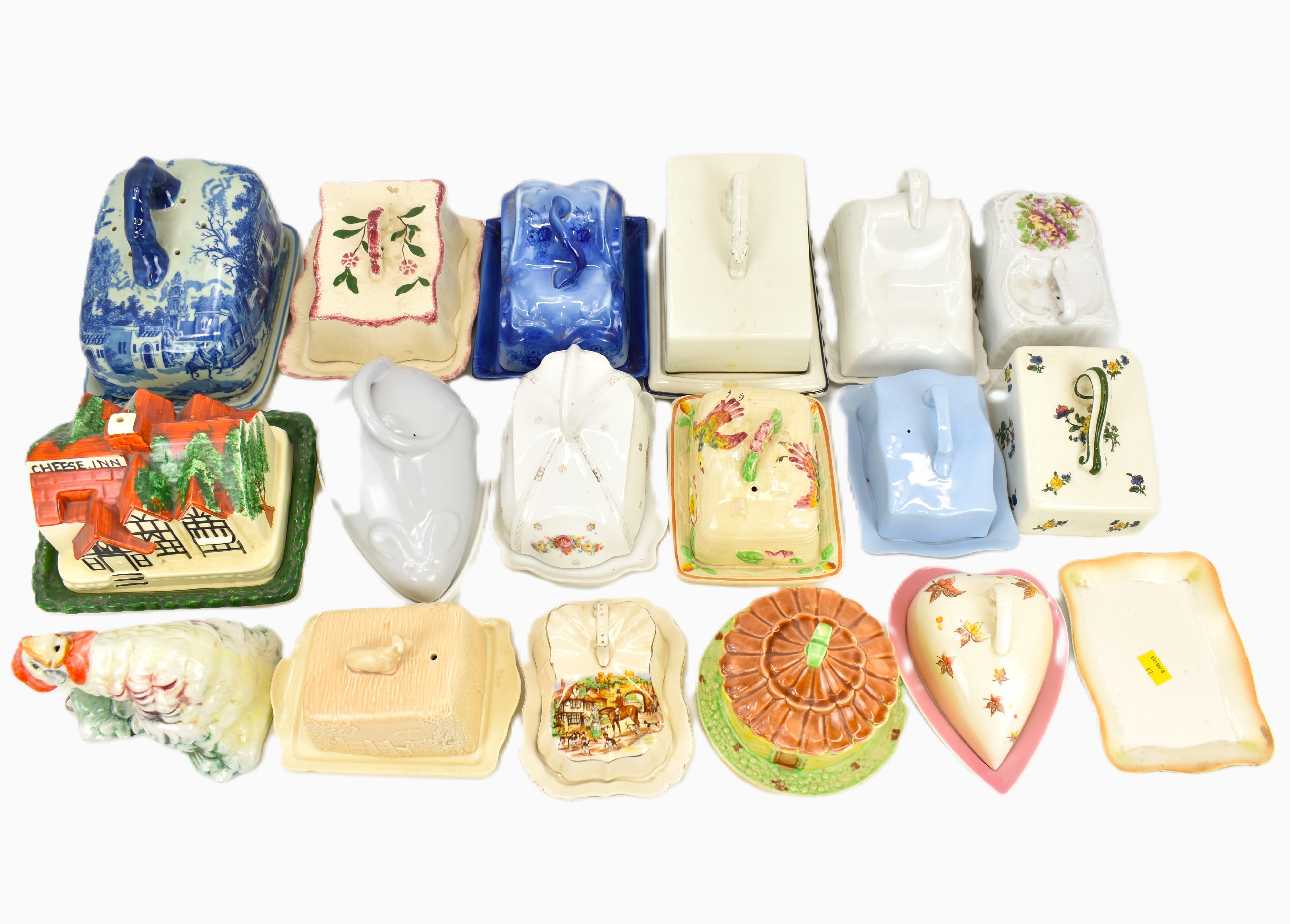 Lot 338 - Thirteen ceramic cheese domes and trays to
