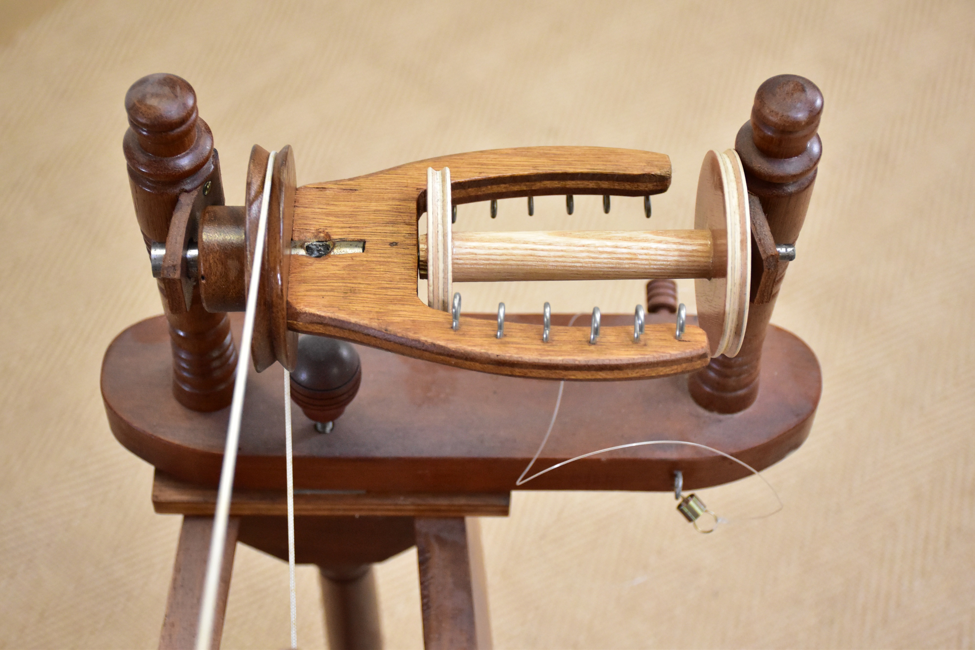 Lot 1200 - A modern hardwood spinning wheel.