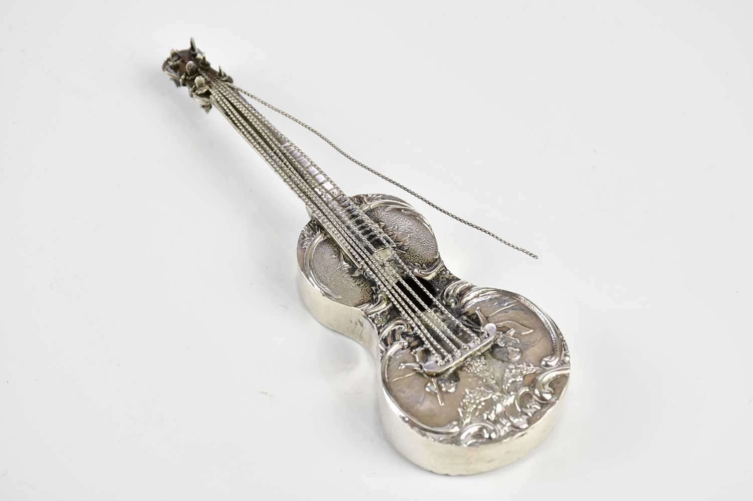 Lot 2149 - A Continental novelty white metal model of