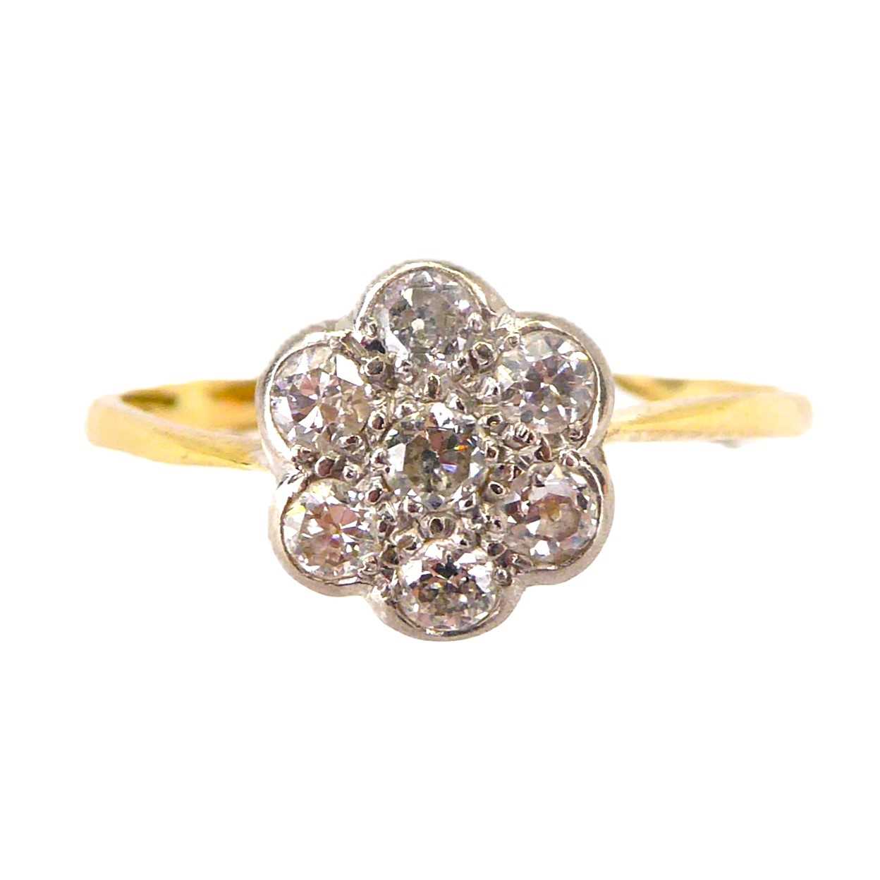 Lot 704 - An 18ct gold flower head cluster ring of