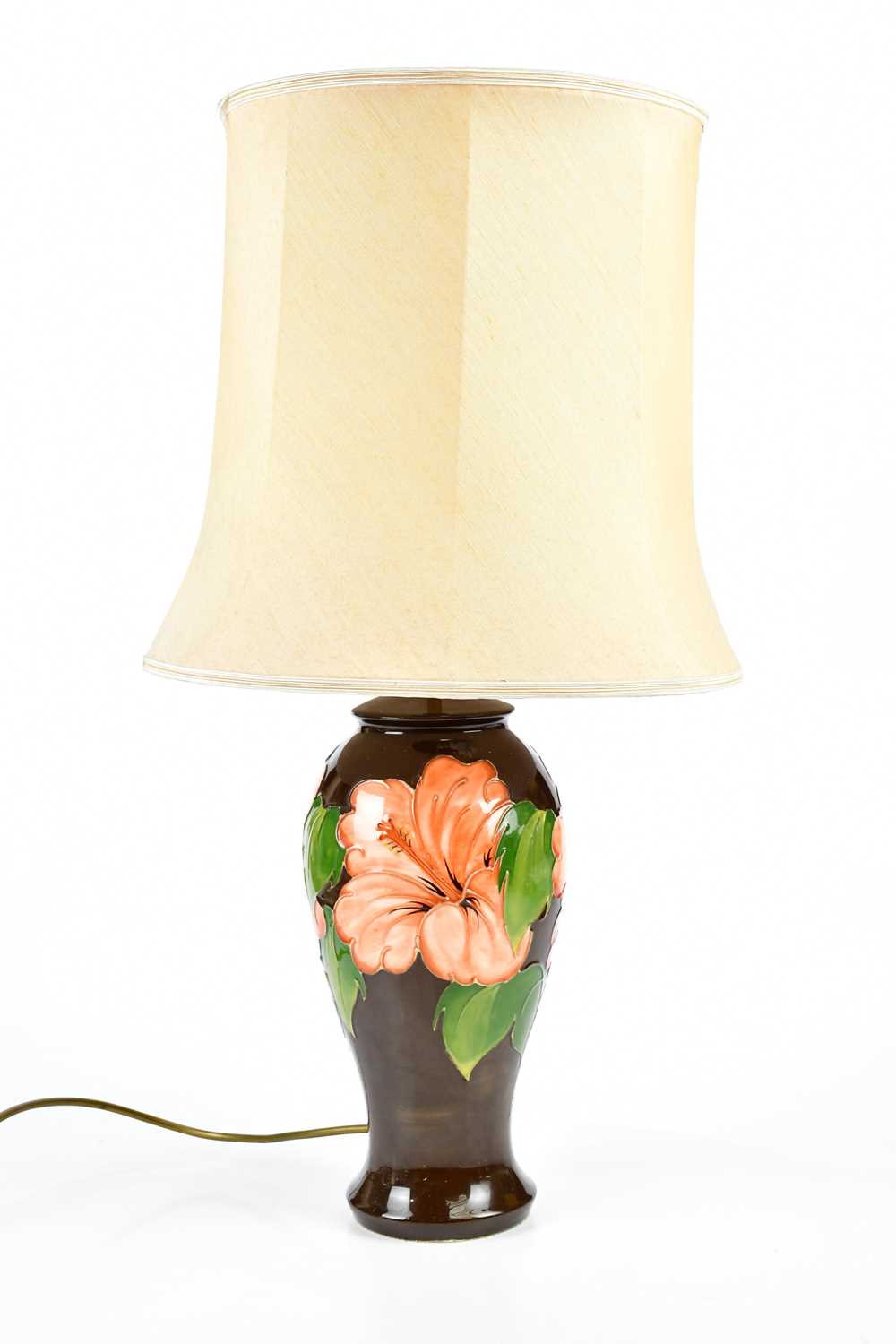 Lot 2774 - MOORCROFT, a 'Hibiscus' pattern table lamp,