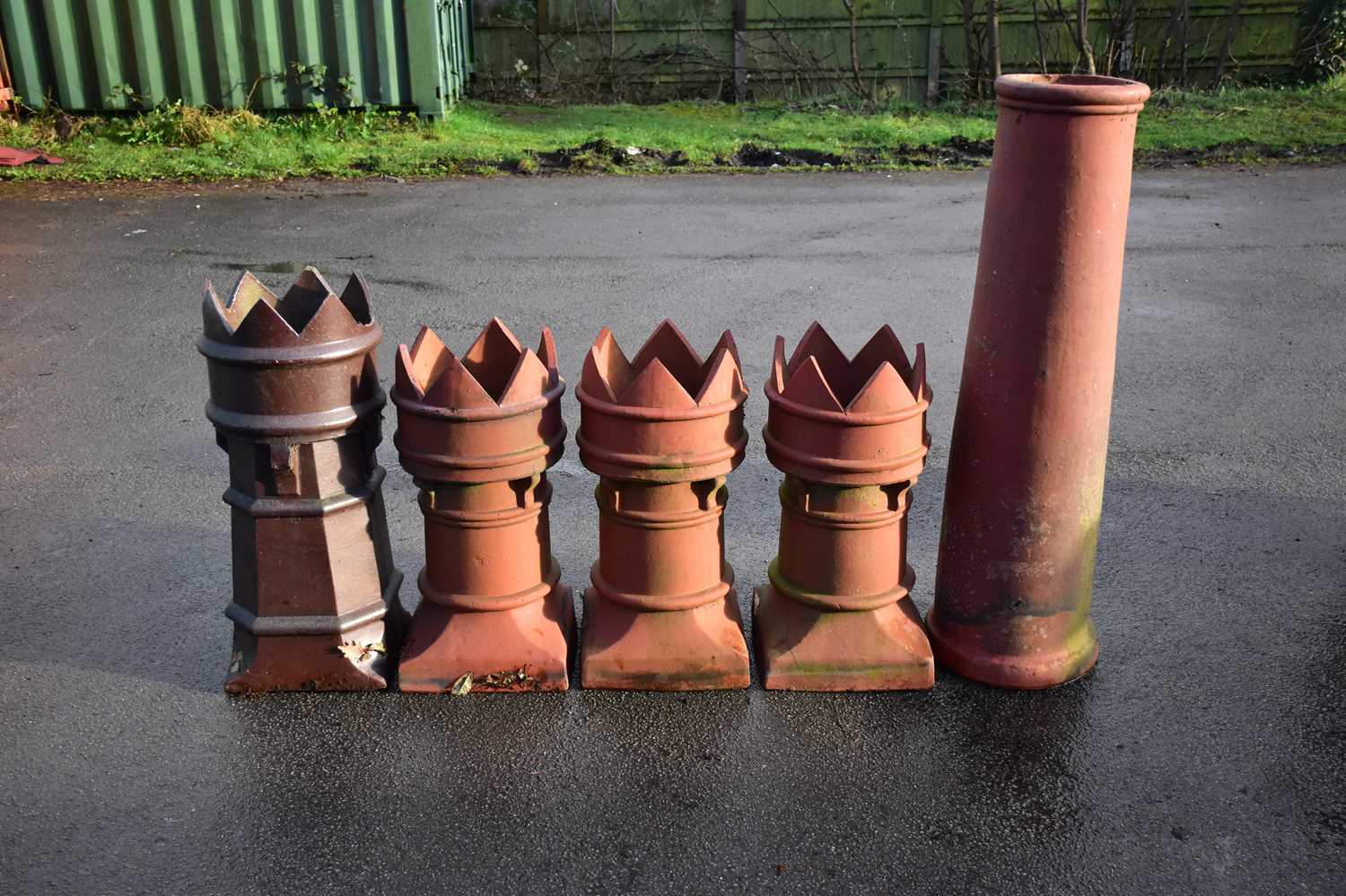 Lot 1226 - Three crown top chimney pots, height 69cm,