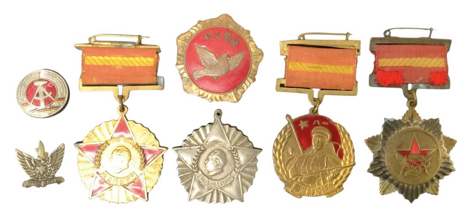 Lot 373 - A group of five Korean and Chinese medals