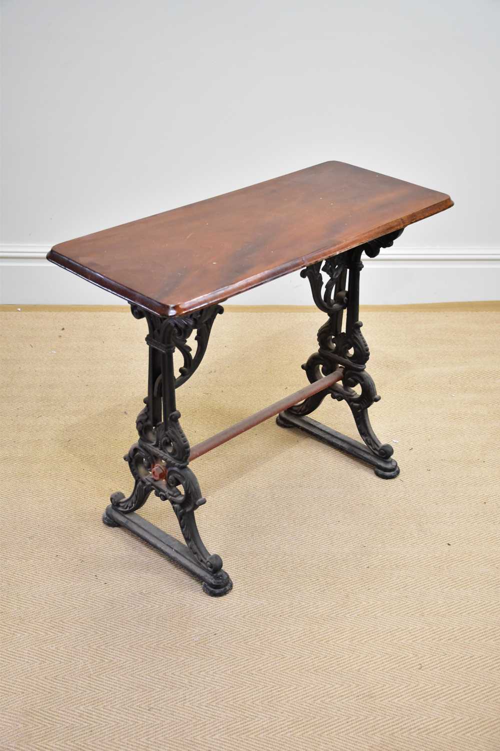 Lot 1080 - A mahogany rectangular table, with cast