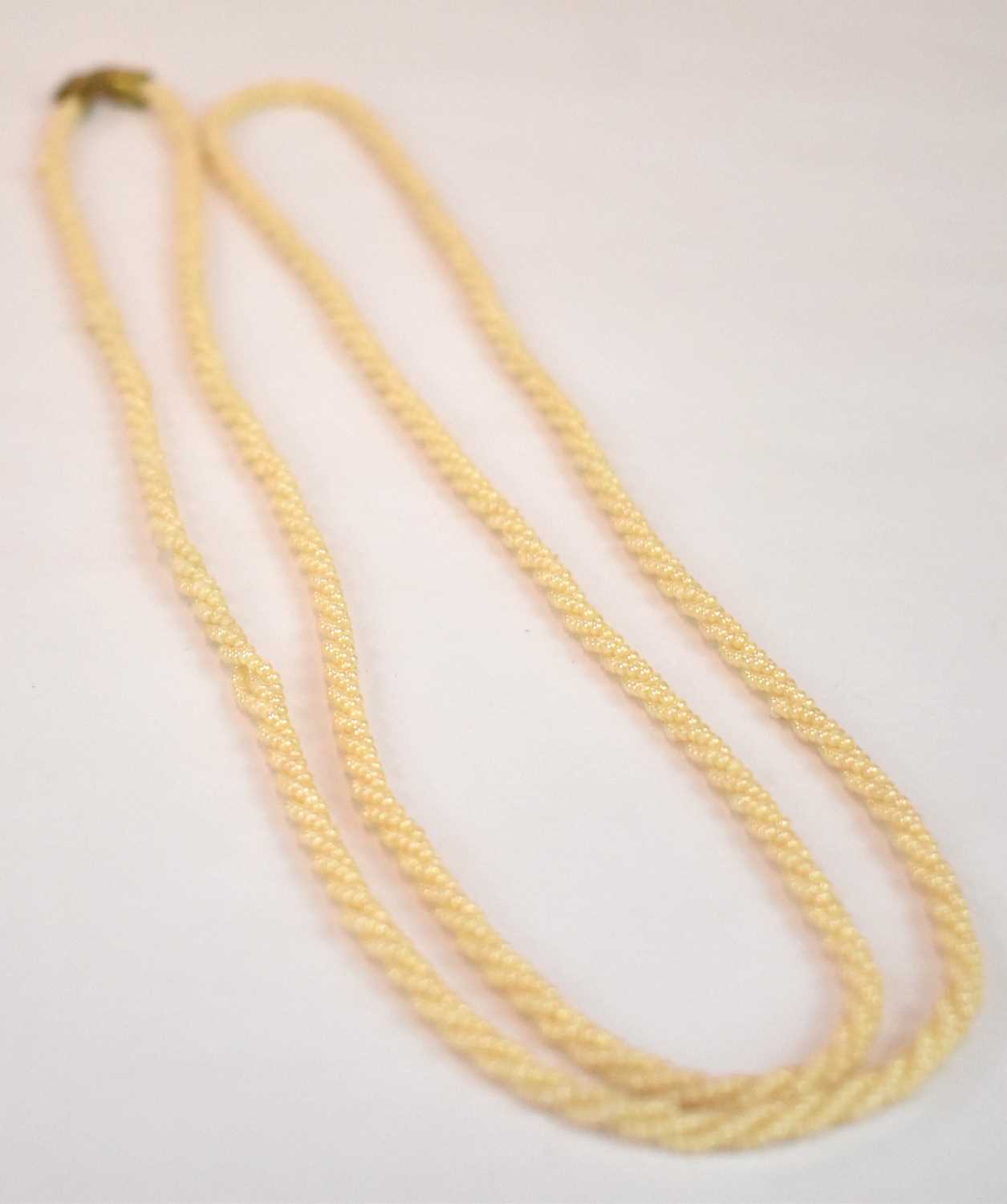 Lot 1186 - An Edwardian opera length multi-string of