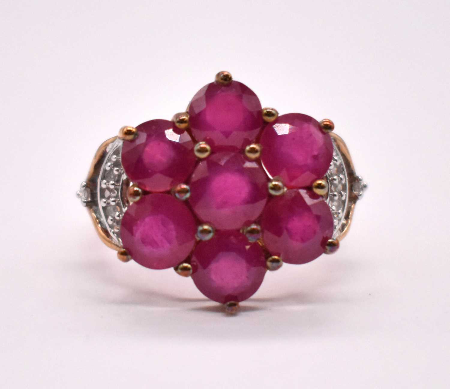Lot 1178 - A 9ct yellow gold simulated ruby dress ring