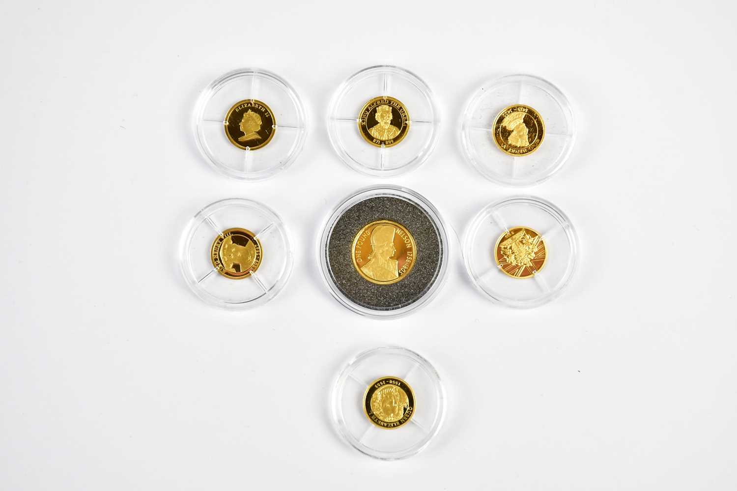 Lot 2563 - Seven proof miniature gold coins including
