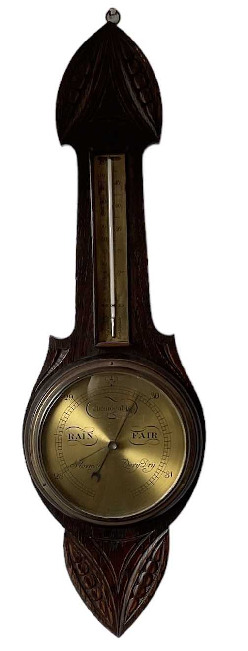 Lot 147 - A 20th century carved oak barometer, height