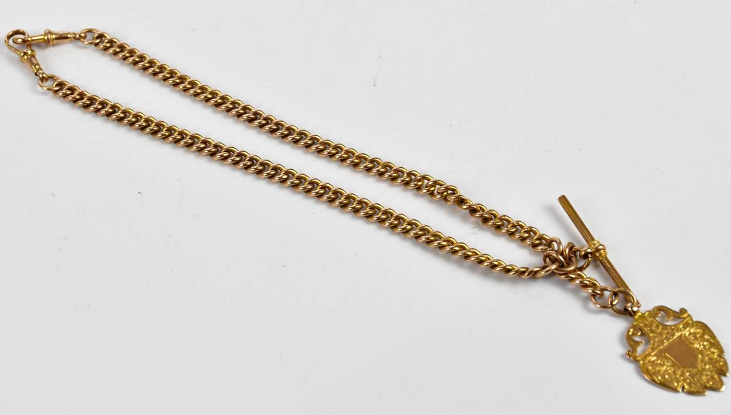 Lot 323 - A 9ct gold double Albert chain, suspending a