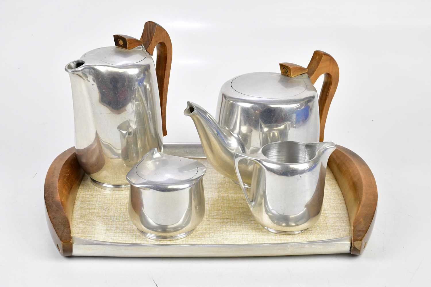 Lot 801 - PICQUOT WARE; a four piece tea set with