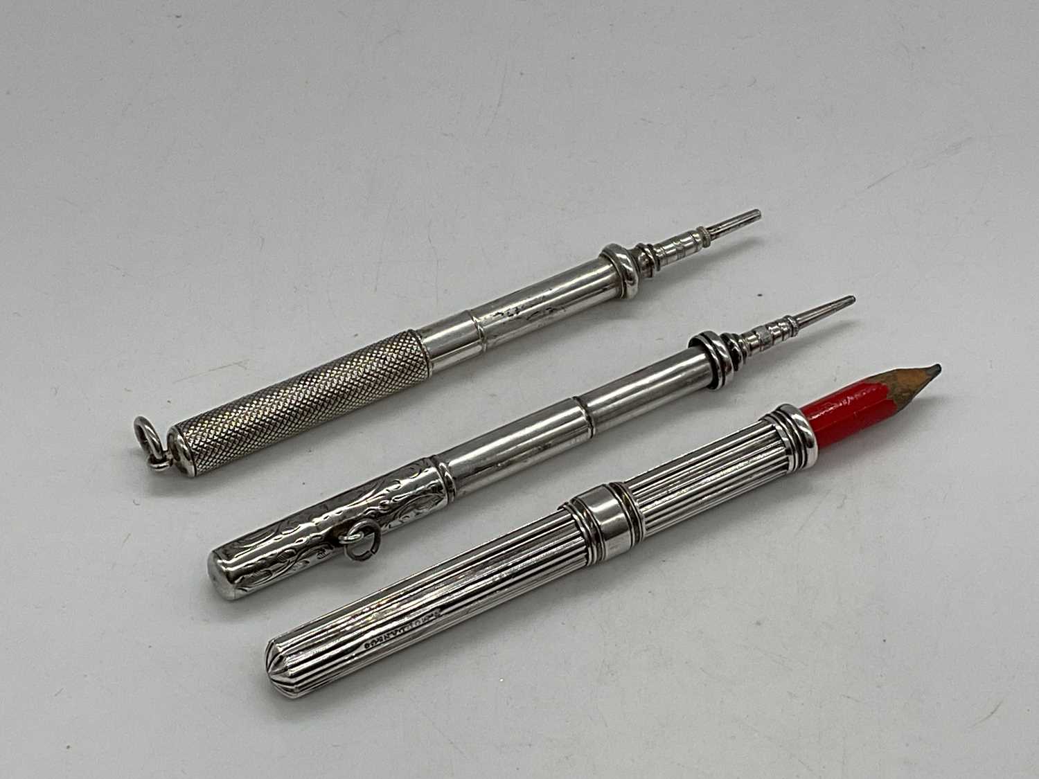 Lot 111 - SAMPSON MORDAN & CO; three silver propelling