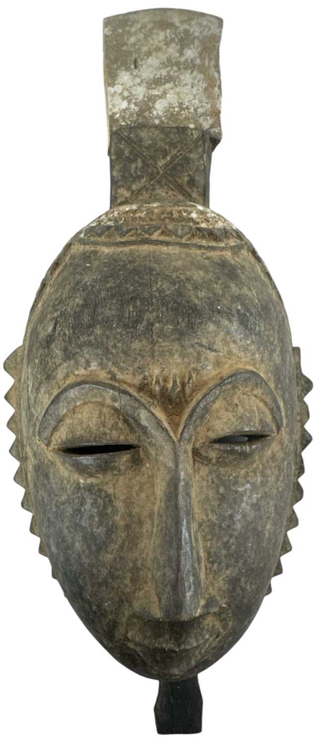 Lot 1231 - A Baule portrait mask, height 40cm, width