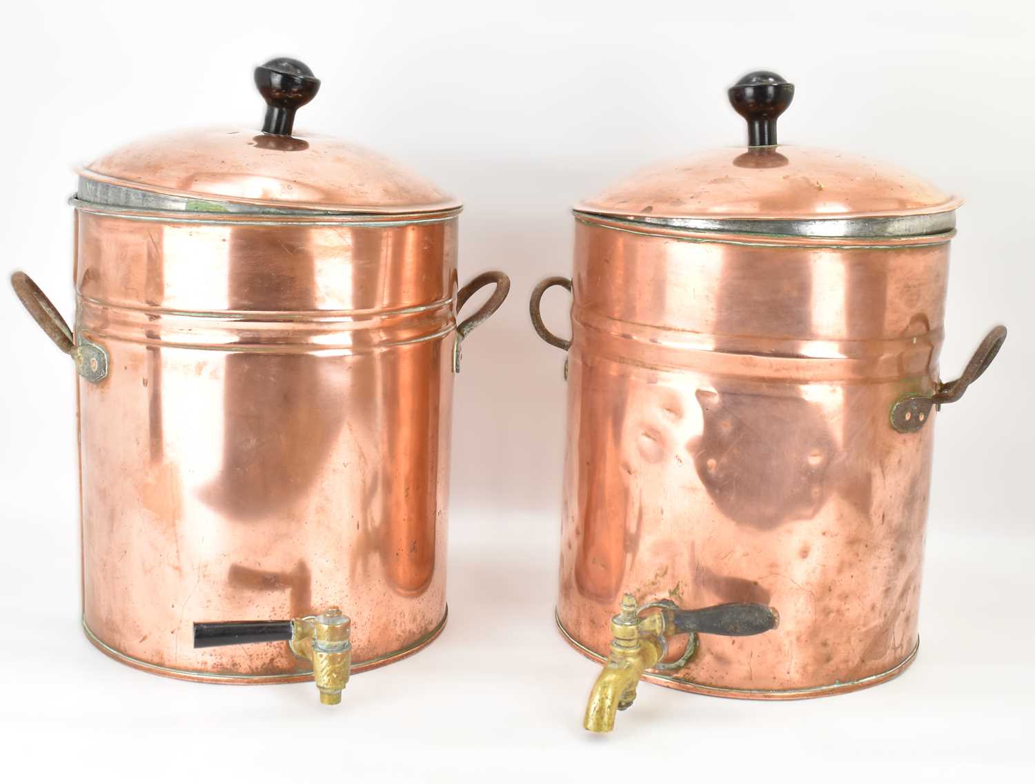Lot 389 - Two vintage copper tea urns, both with steel