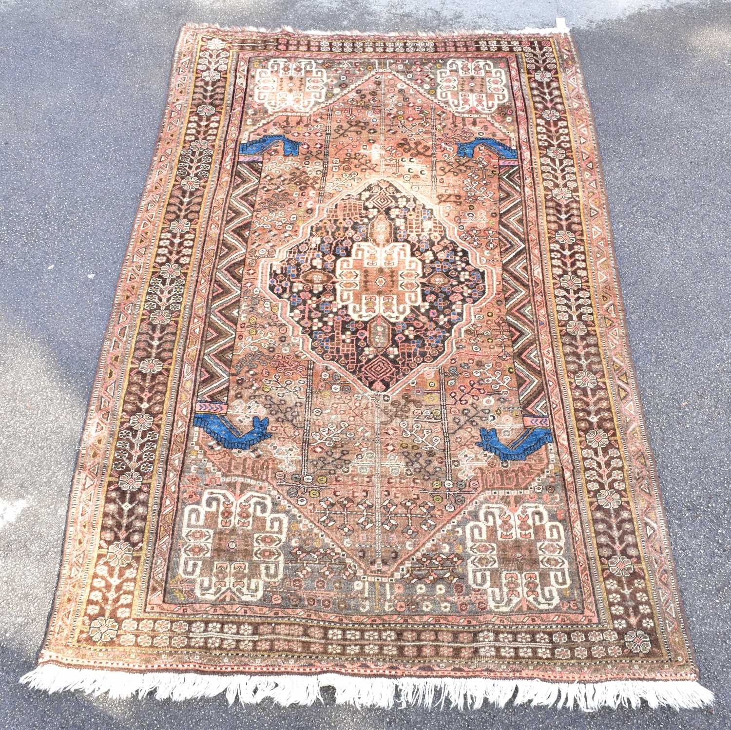 Lot 1469 - A Caucasian hand woven wool rug, with