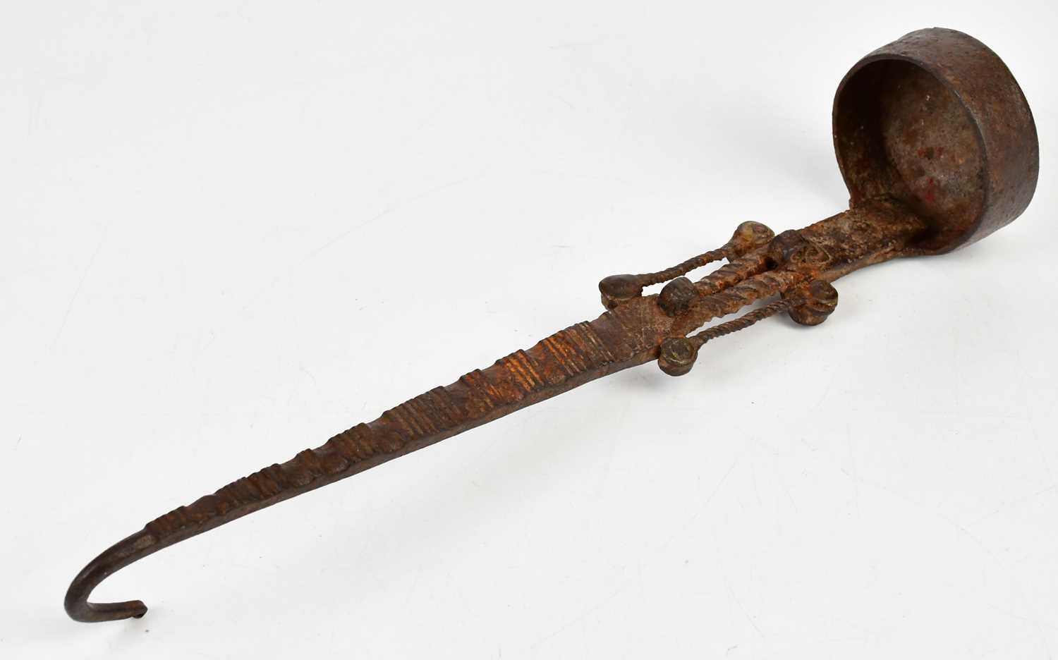 Lot 563 - A 17th century wrought iron ladle with open