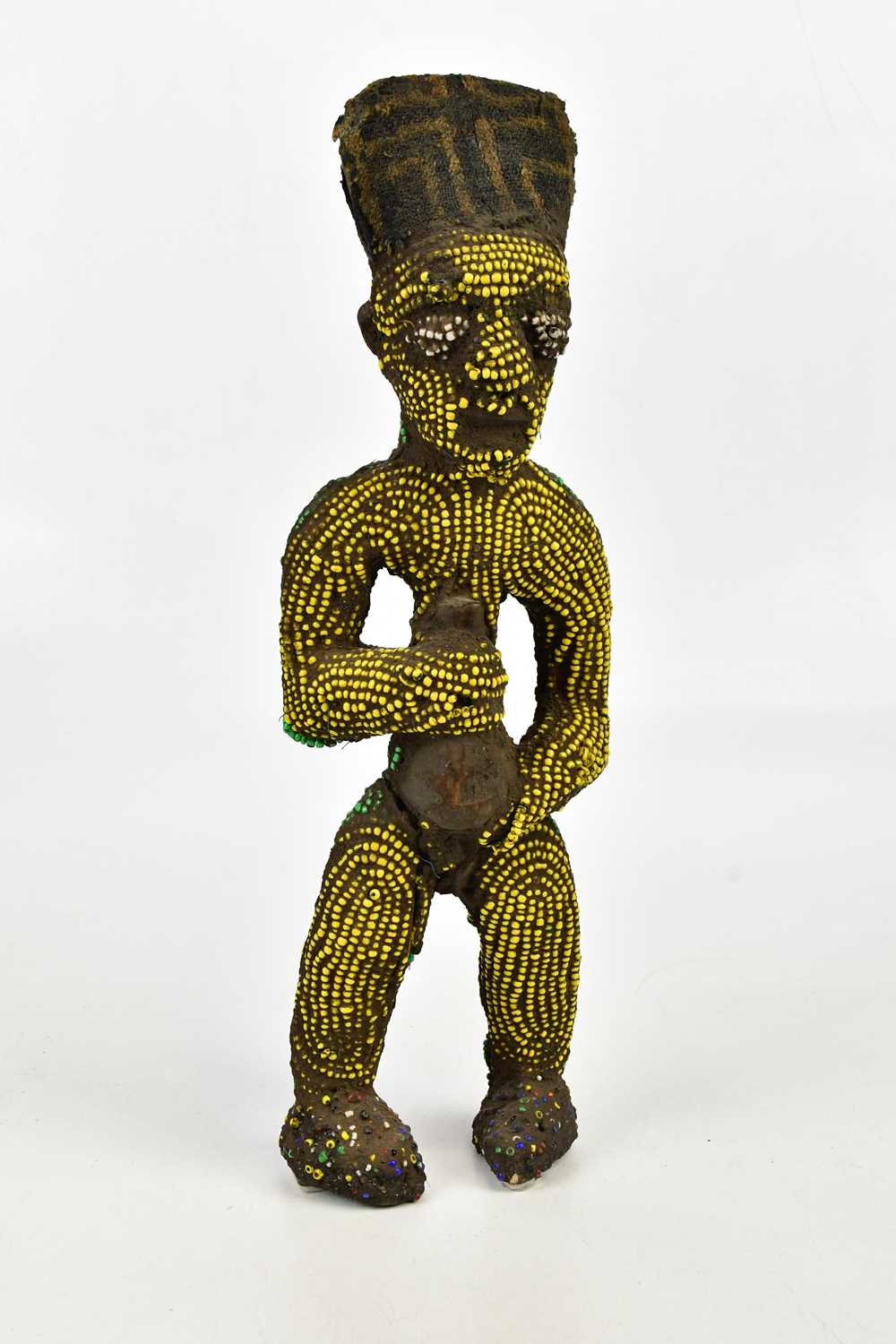 Lot 1327 - A Bamileke wood, clay and bead figure,