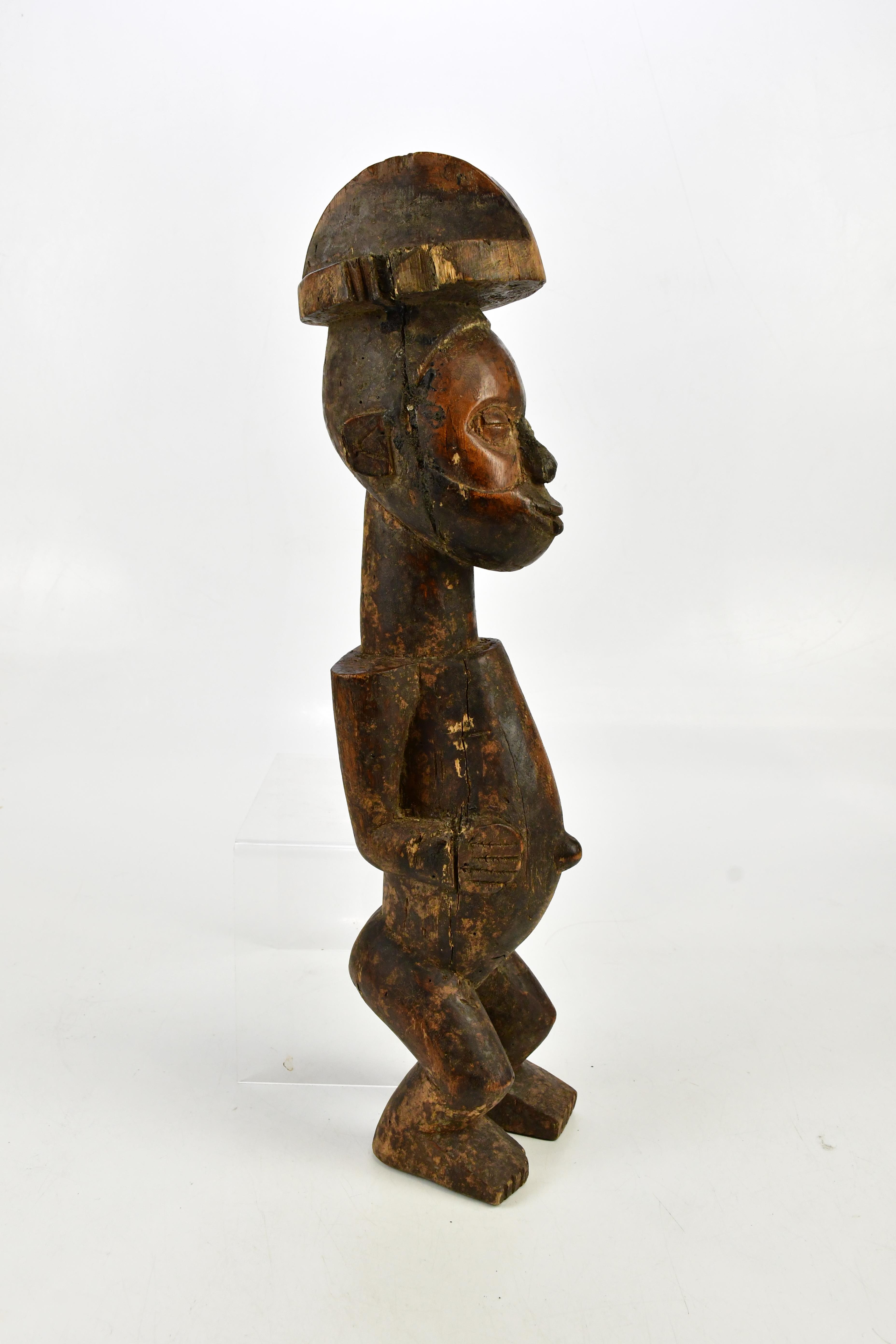 Lot 1328 - A Nkisi carved wooden Congo spirit figure,