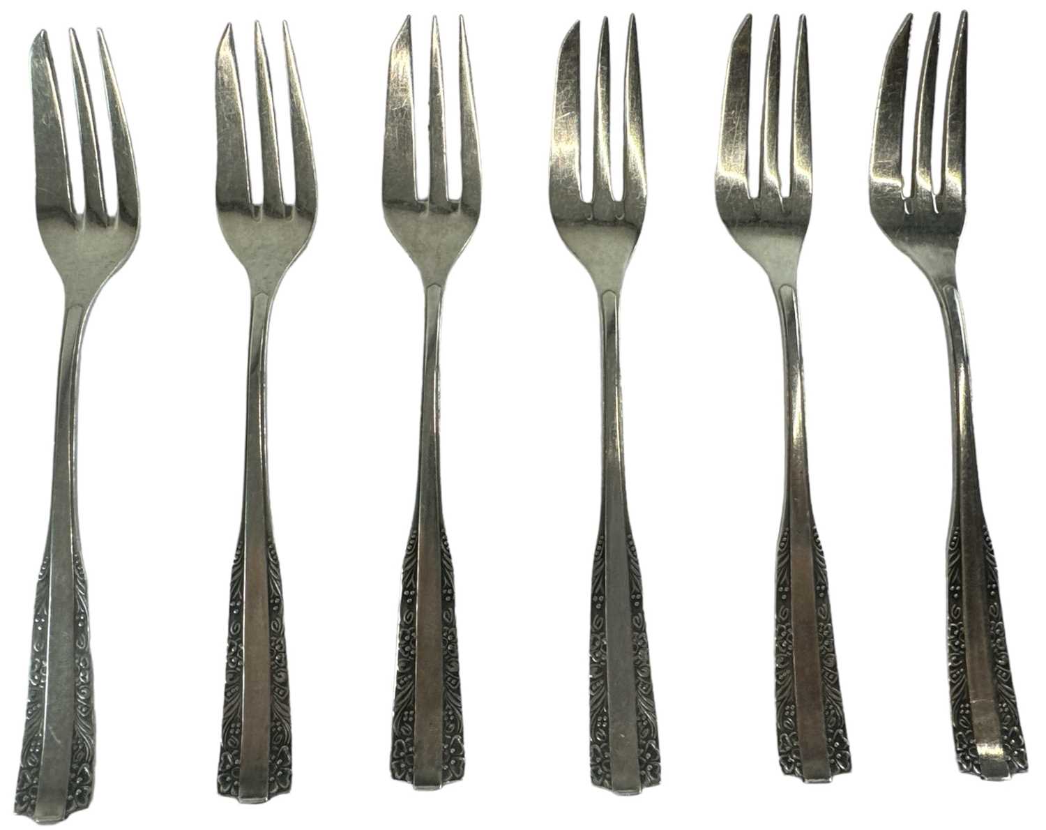 Lot 1314 - A set of six 800 grade silver cake forks,