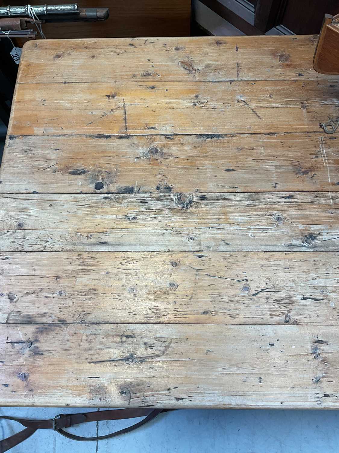 Lot 64 - A large rustic pine farmhouse table of plank