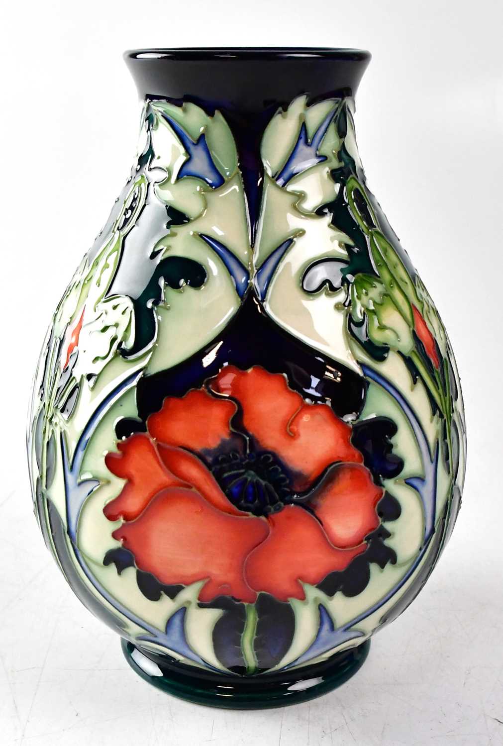 Lot 131 - MOORCROFT; a vase in the 'Poppy' design,