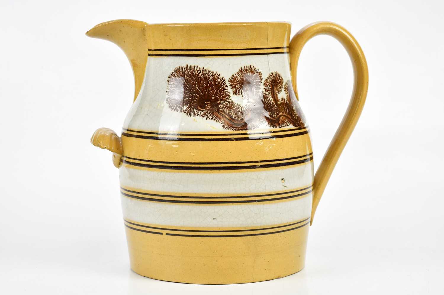 Lot 1394 - A 19th century Mocha ware jug, decorated