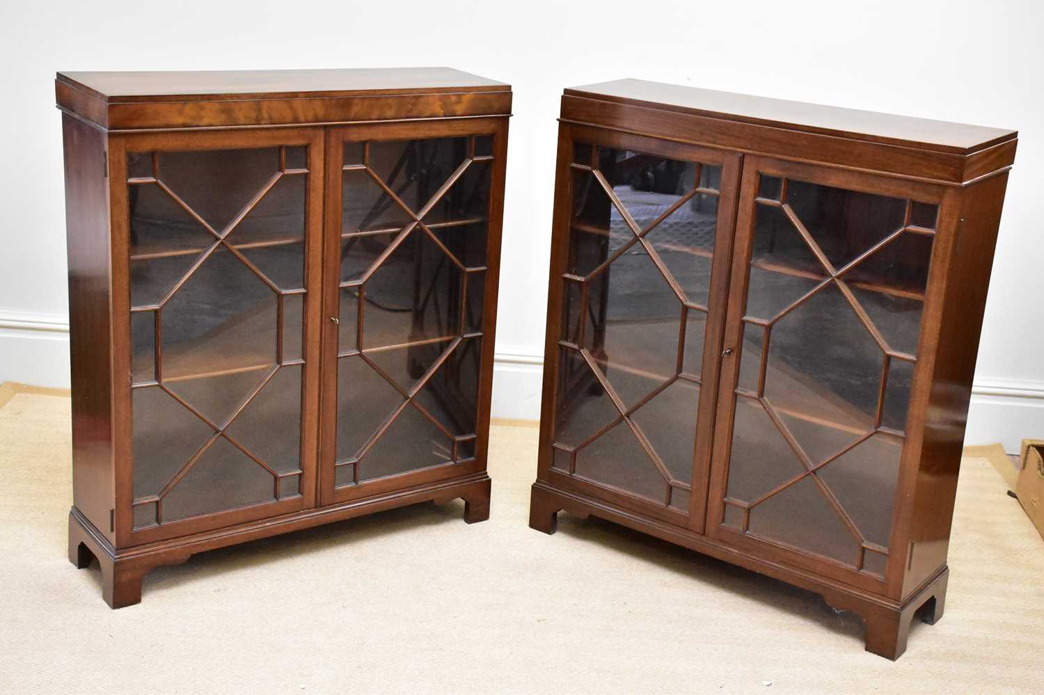 Lot 194 - A pair of Waring & Gillow mahogany bookcases,