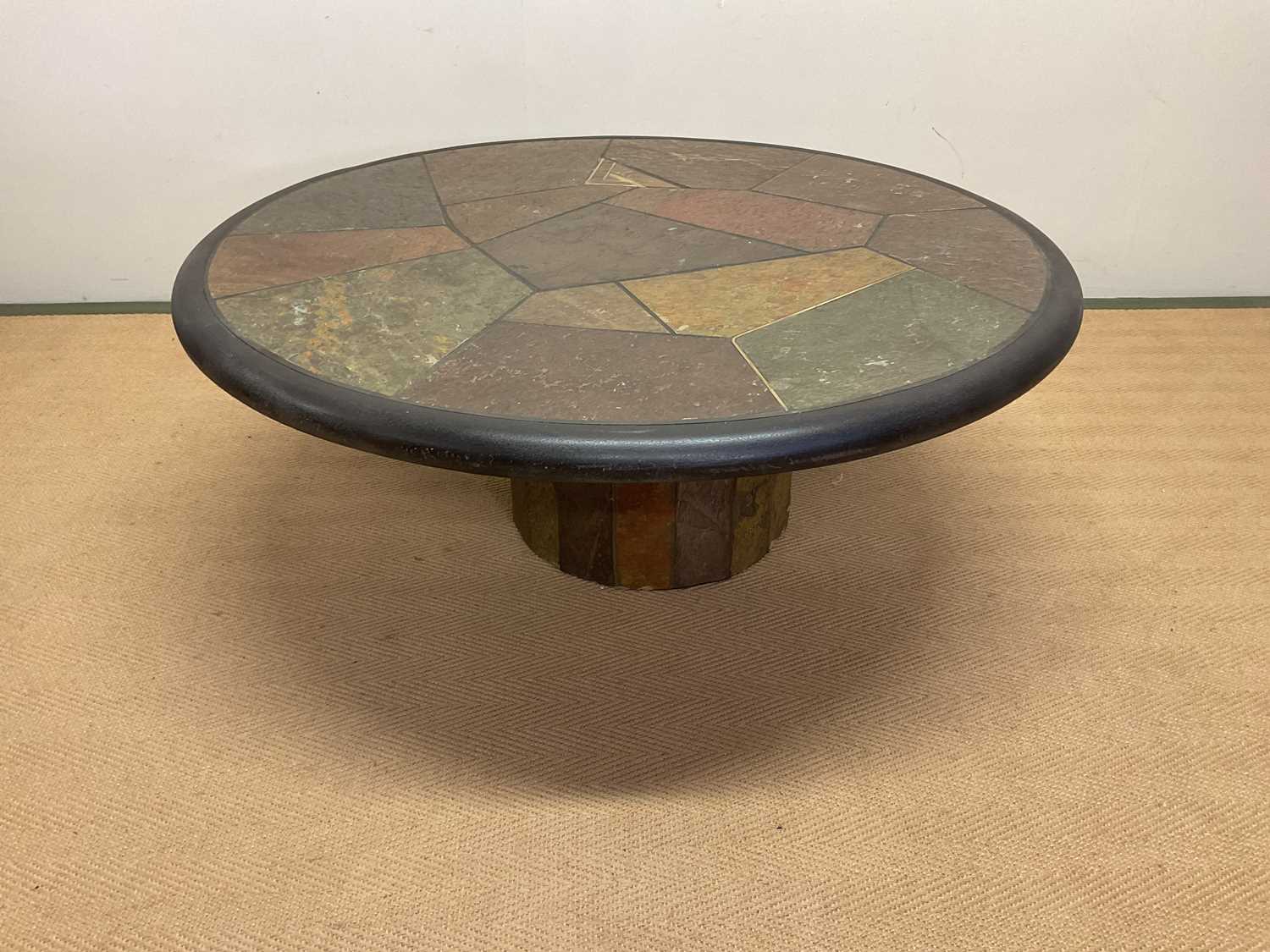 Lot 628 - PAUL KINGMA; a circular polished stone table