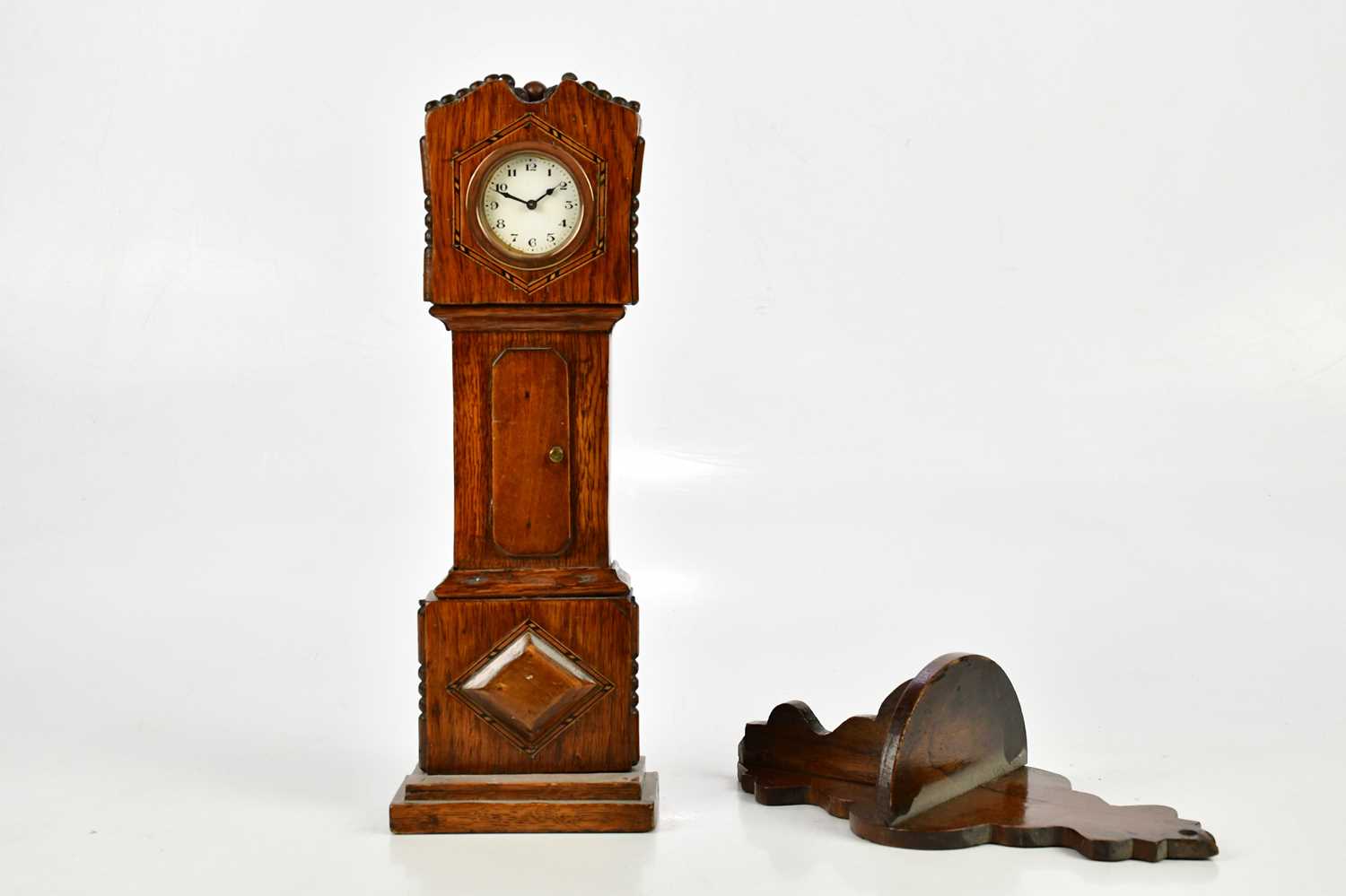 Lot 582 - An oak miniature longcase clock, the dial