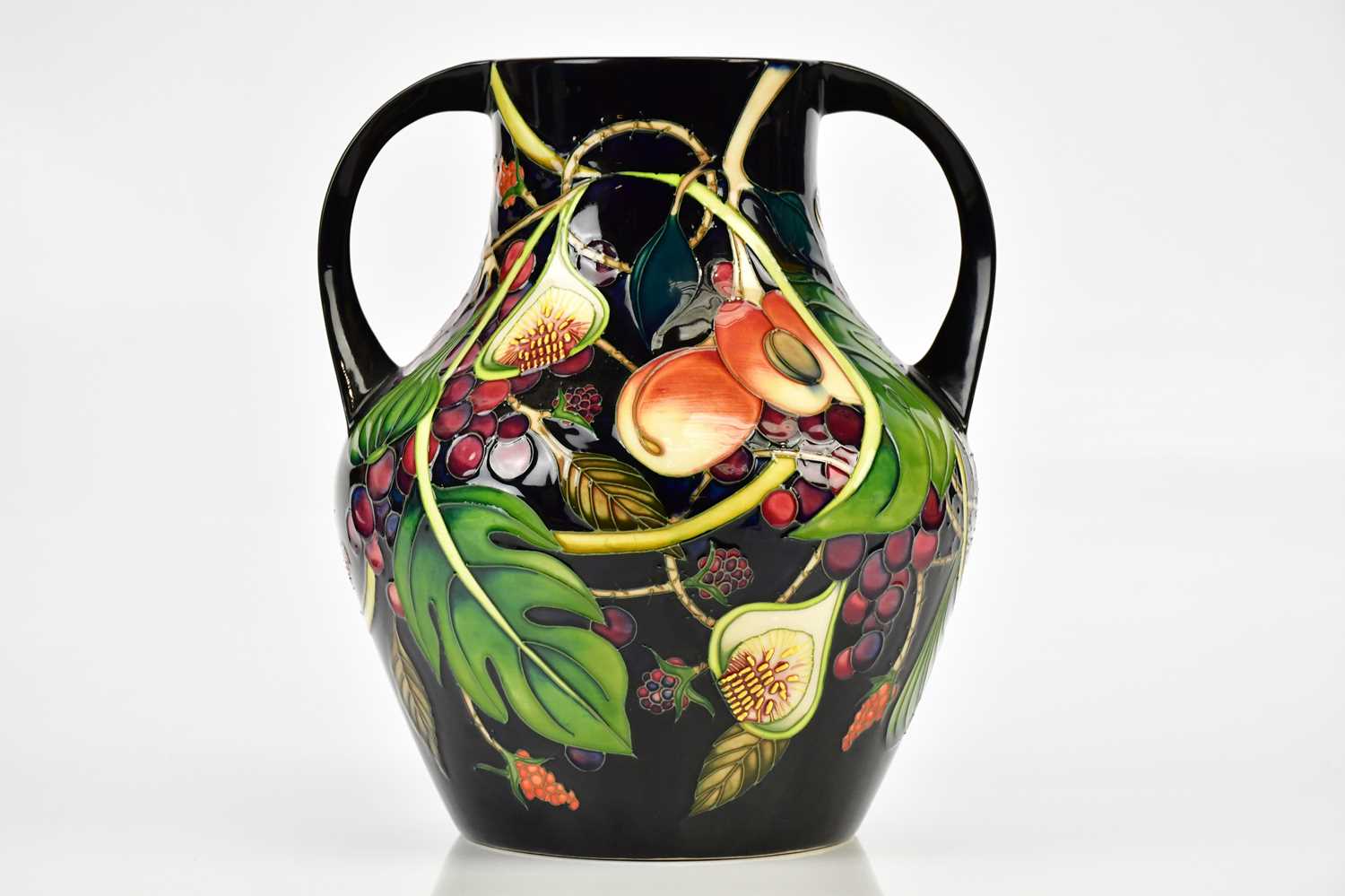 Lot 2232 - EMMA BOSSONS FOR MOORCROFT; a twin handled