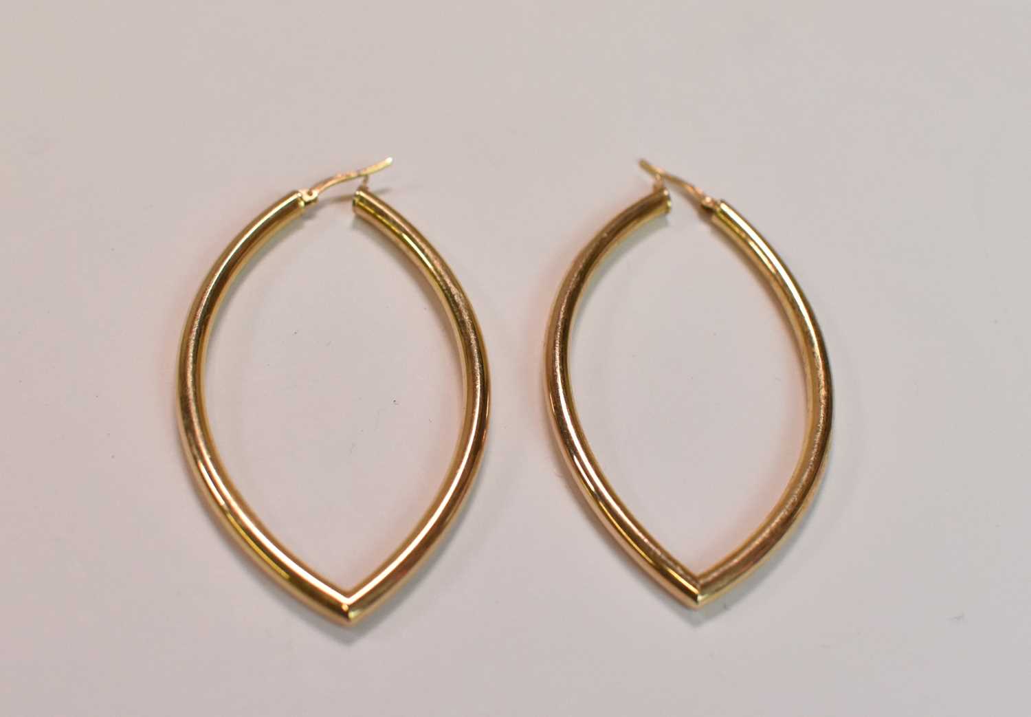 Lot 493 - A pair of 9ct yellow gold hollow hoop