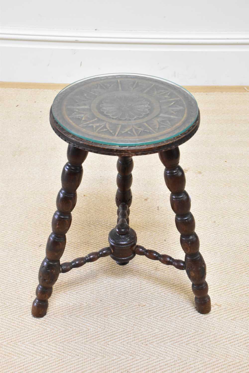 Lot 148 - A 19th century carved oak stool, height 50cm,