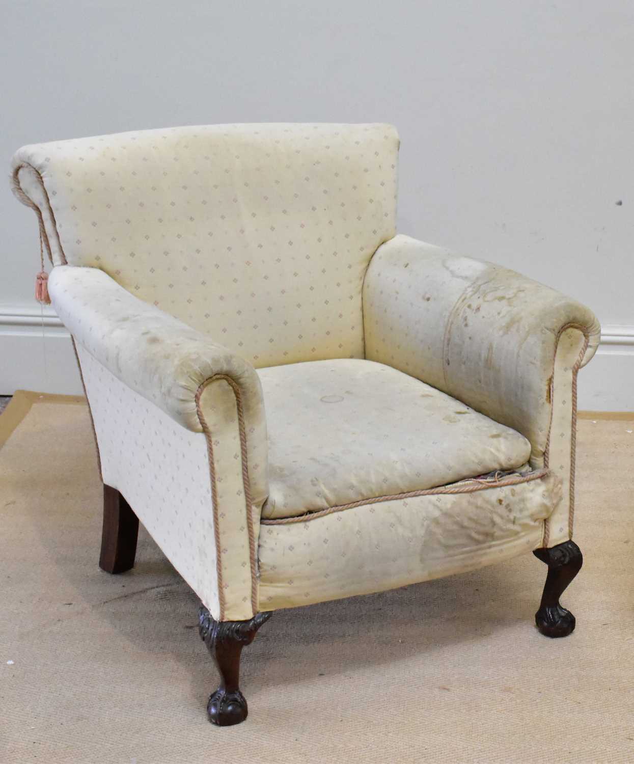 Lot 186 - An early 20th century scroll back armchair